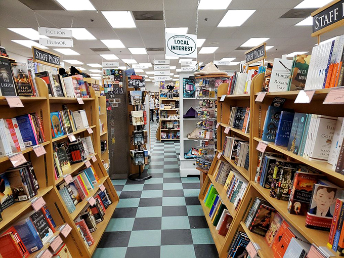 Signs hanging from the ceiling are your only navigation tools in this biblio-maze. The fiction section alone could swallow an afternoon.