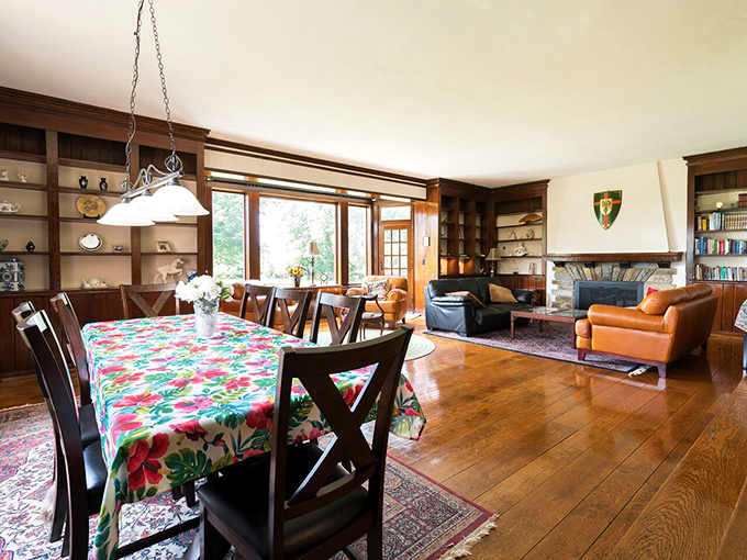 Sunlight streams through windows in this open-concept dining area, where family stories are shared over meals fit for royalty.