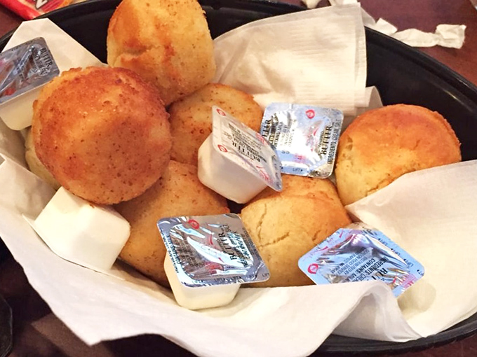 These cornbread muffins aren't just bread&mdash;they're edible Southern sunshine. Butter packets stand by, knowing their destiny is to melt into these golden orbs.