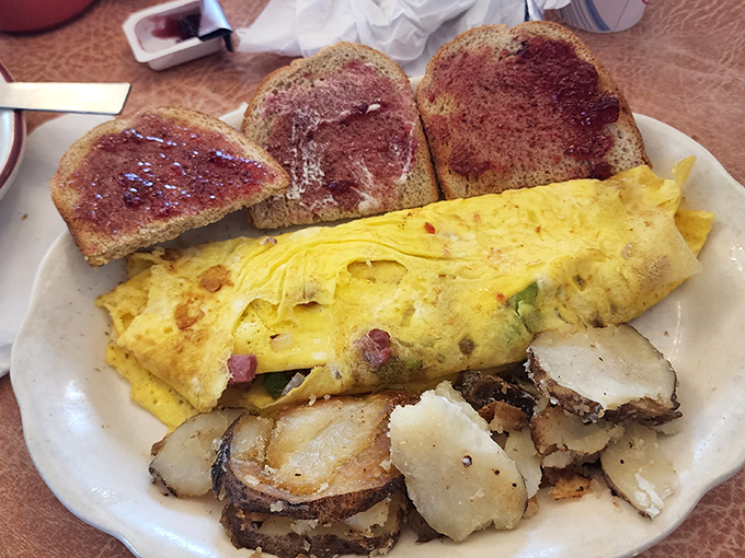 This seafood pot pie, served alongside applesauce, proves that Pennsylvania Dutch cooking isn't just about chicken—it's about transforming anything into soul-satisfying comfort.