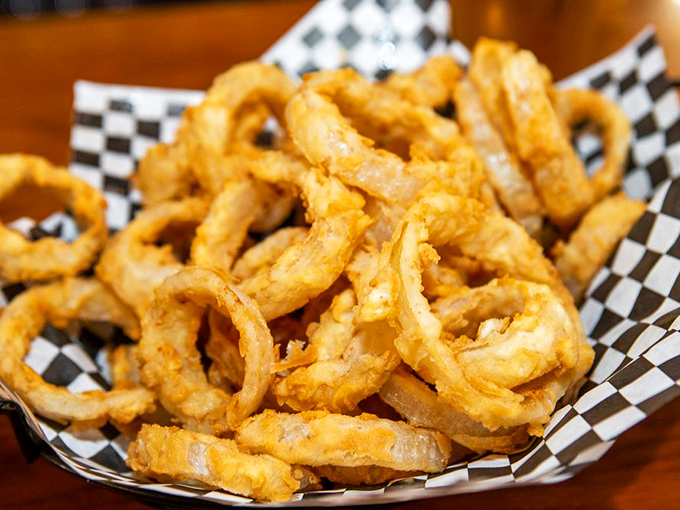 Onion rings so golden and plentiful they spill over their checkered paper boat&mdash;the kind that make you temporarily forget that vegetables are supposed to be healthy.