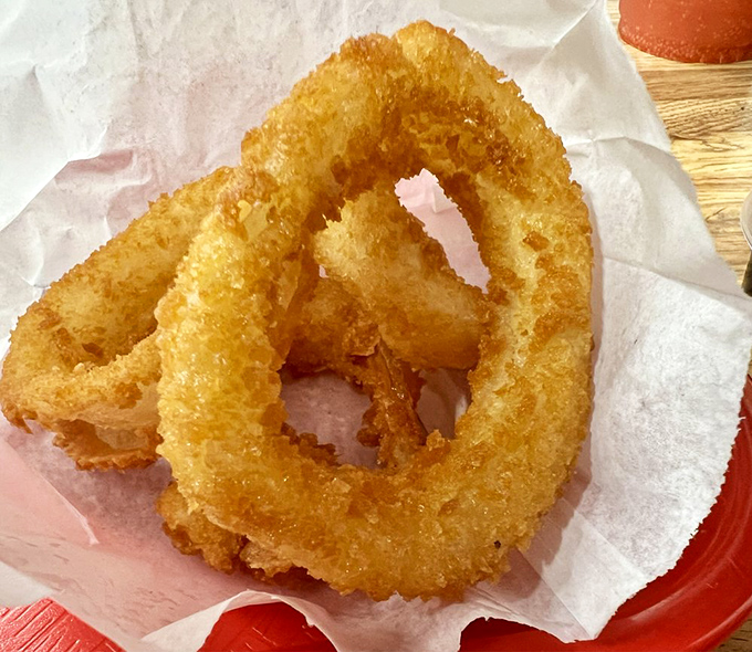 These onion rings aren't just fried&mdash;they're golden halos of happiness that crunch loud enough to drown out your diet's complaints.