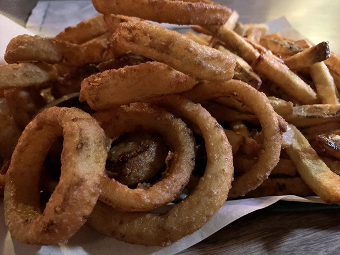 The "Half & Half" basket—where onion rings and fries live together in perfect harmony, no mediator required.