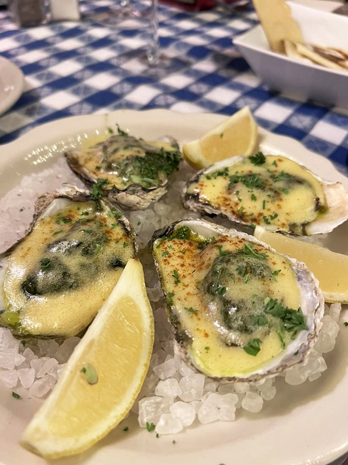 Oysters on ice&mdash;nature's perfect appetizer. Topped with a buttery sauce, they're like little ocean treasures in formal wear.
