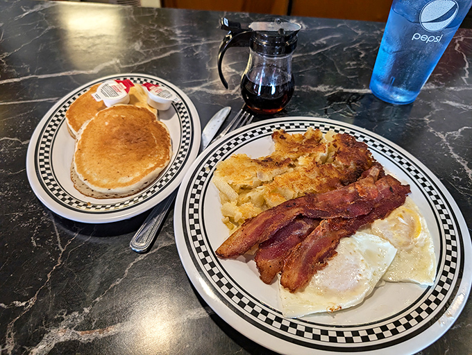 Classic pancakes and eggs with bacon&mdash;the breakfast holy trinity. Some mornings don't need innovation, just perfectly executed classics served on checkered plates.