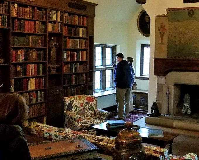Visitors pause by leaded glass windows, perhaps imagining the Weddells gazing out at the same view, just in different centuries.