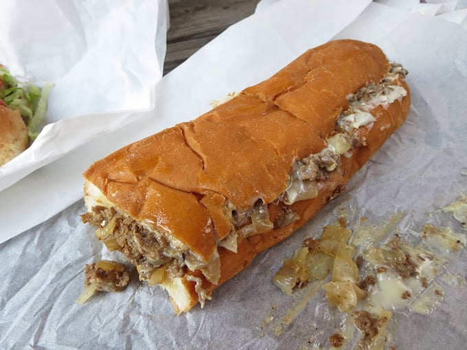 The cross-section reveals the truth: perfectly chopped steak, melted cheese in every crevice. It's sandwich engineering at its finest.