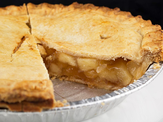 One slice missing reveals the golden secret within&mdash;perfectly cooked apples suspended in their own caramelized juices. Resistance is futile.