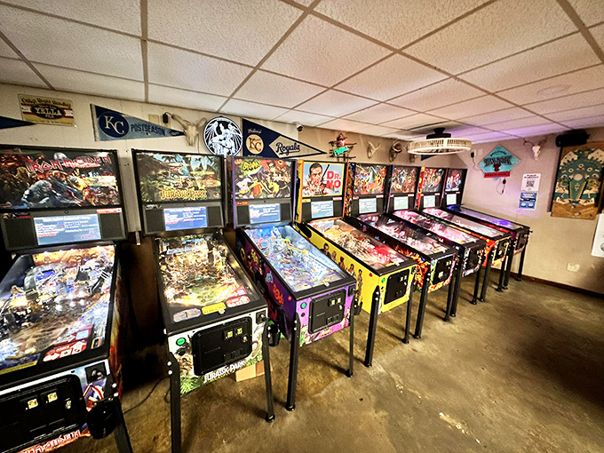 A row of mechanical time machines, each telling stories through bumpers and ramps rather than pages or screens.