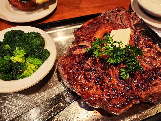 The porterhouse doesn't just sit on the plate—it commands it, with a bone that could make Fred Flintstone weep with joy.