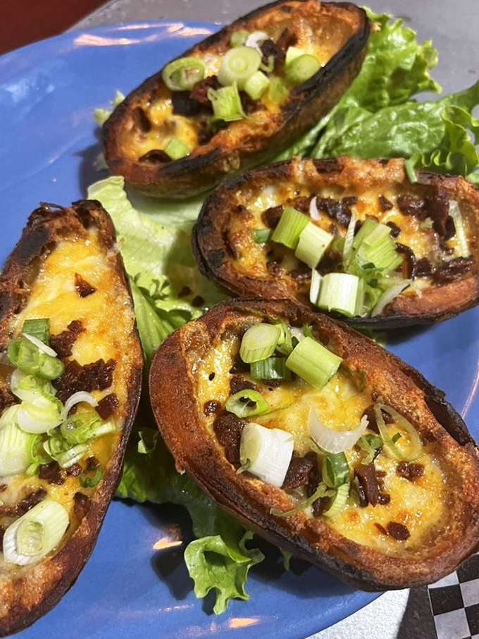 Loaded potato skins that could make a vegetarian weep with temptation. Cheese bubbling like tiny volcanic eruptions of flavor.
