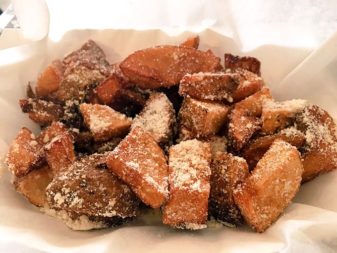 Golden-brown, perfectly seasoned potatoes dusted with parmesan that would make any Italian grandmother nod in approval. Carb heaven exists, and it's right here.