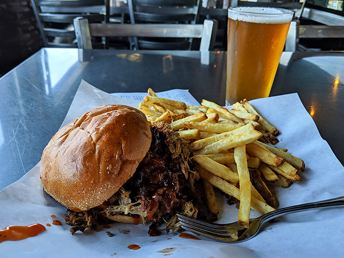 The pulled pork sandwich that launched a thousand napkins. A beautiful mess worth every sauce stain on your favorite shirt.