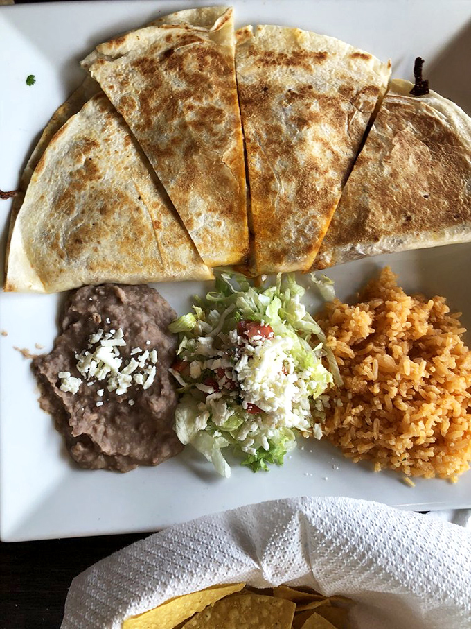 This quesadilla isn't playing games&mdash;golden-brown tortilla, perfectly melted cheese, and sides arranged with the precision of a small art installation.