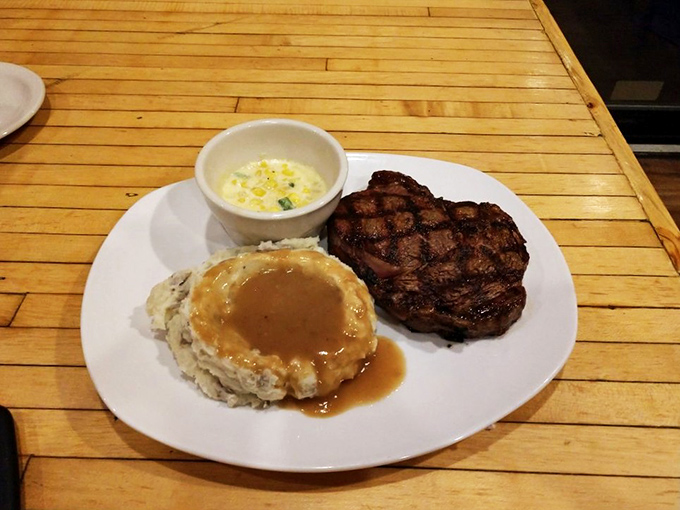 A ribeye, mashed potatoes with gravy, and corn&mdash;the holy trinity of Midwest comfort. This plate doesn't just feed you; it hugs you from the inside.
