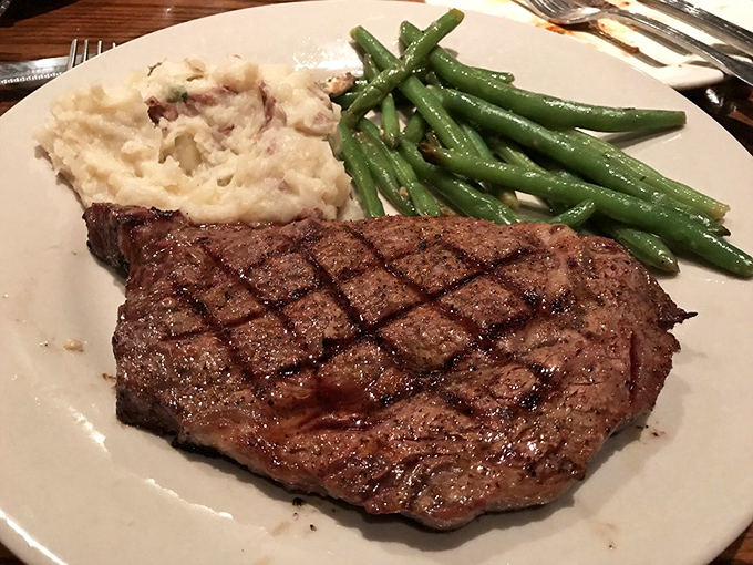 A ribeye that would make even the most dedicated vegetarian pause for reflection. Those green beans provide the illusion of virtue.