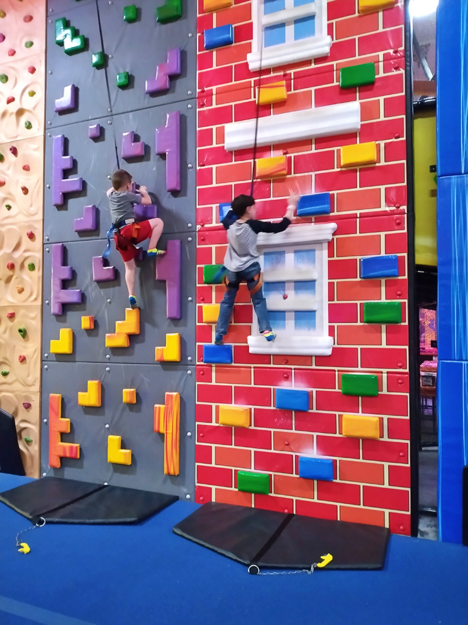 These climbing walls transform children into spider-people before your eyes, scaling colorful challenges that would make Peter Parker proud.