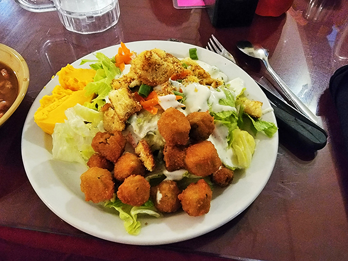 A salad that doesn't apologize for being a salad. Those golden croutons and crispy fried bites prove that even vegetables can have a good time in Oklahoma.