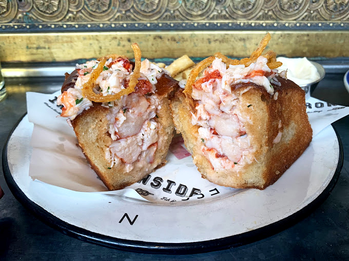 Lobster and crispy onions atop a buttery brioche &ndash; proof that sometimes the best relationships are the simplest ones.