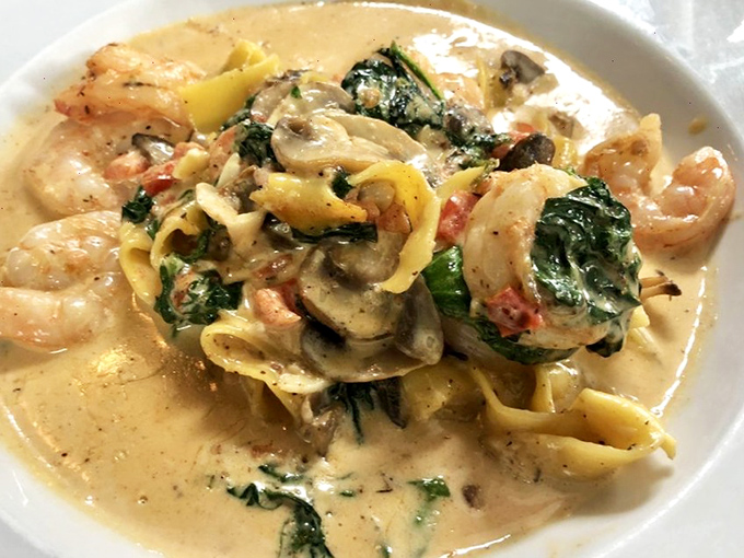 Pasta that doesn't know it's in a steakhouse. Plump shrimp and fresh spinach swimming in a cream sauce that would make an Italian grandmother nod in approval.