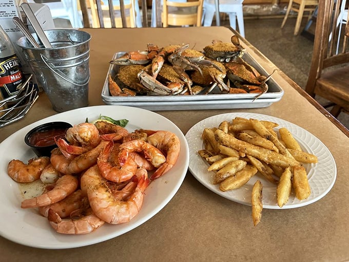 The holy trinity of Maryland feasting: steamed crabs, peel-and-eat shrimp, and Old Bay fries. Seafood heaven exists, and it's right here.