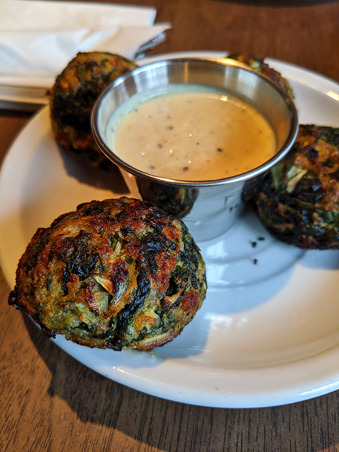 Spinach balls: the appetizer you didn't know you needed in your life. Crispy outside, tender inside, and that Dijon cream sauce is pure genius.