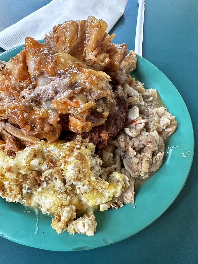 Ham, chitterlings, and sides sharing a plate like old friends at a reunion. No food stylist needed when it tastes this good.
