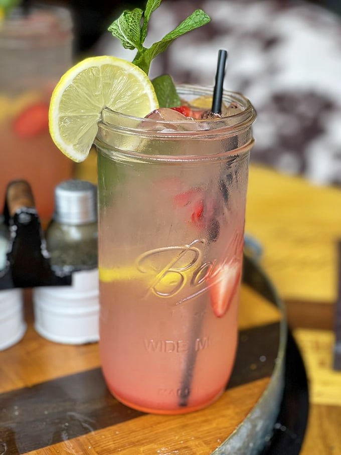 A mason jar stuffed with summer in liquid form, garnished with a lime slice that's not just for show.