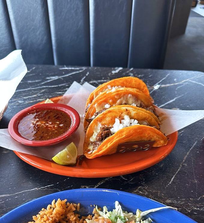 Crispy-edged street tacos with a lime wedge standing by. They're small but mighty, like the best character actors in a blockbuster film.