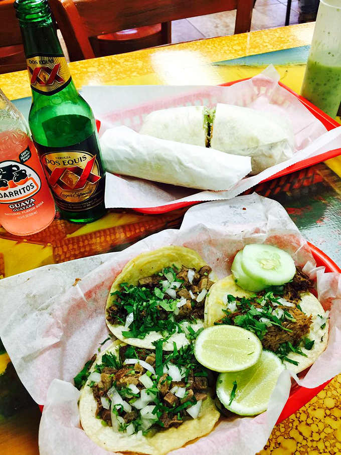 These tacos aren't just topped with cilantro and onion &ndash; they're crowned with them. The lime wedges stand ready for their supporting role in this flavor production.