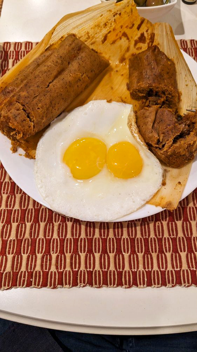 Breakfast of champions: tamales paired with sunny-side-up eggs. This plate proves that corn husks at breakfast time should be a more universal concept.
