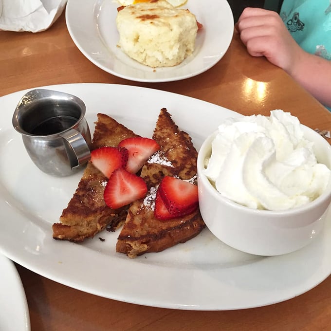 French toast that makes you forget all other breakfast foods exist. Those strawberries aren't garnish&mdash;they're supporting actors in a delicious drama.