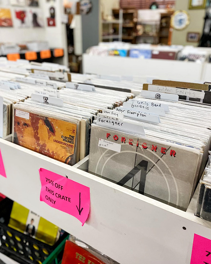 Vinyl records organized by artists who soundtracked our youth. Finding that Foreigner album feels like reuniting with an old friend.