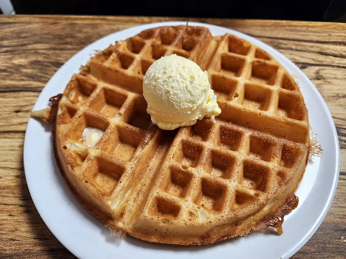 This golden waffle with a scoop of vanilla ice cream isn't just breakfast&mdash;it's what angels eat when nobody's looking.