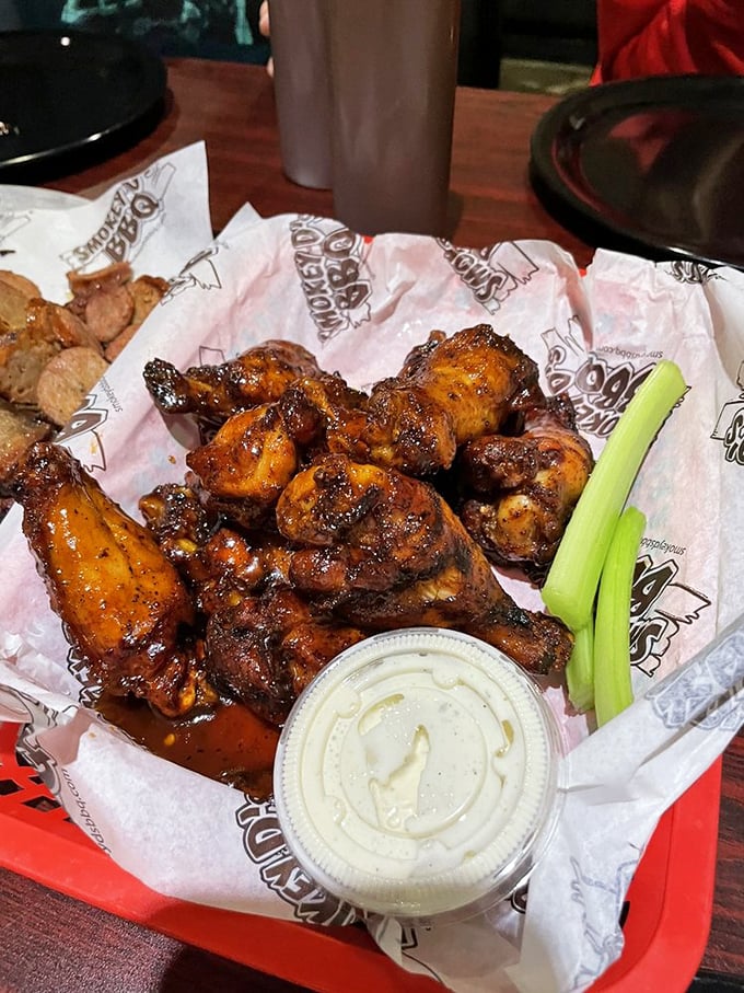 Wings that make you question your loyalty to all other wings. Glistening with sauce and beckoning with smoky promises.