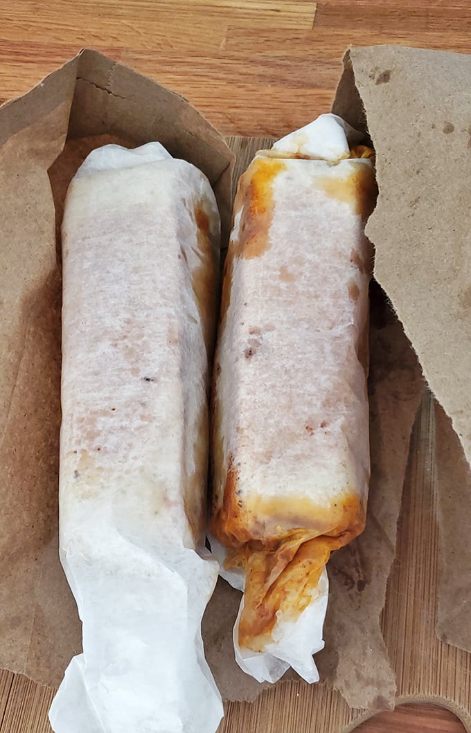 Wrapped like precious cargo, these hot dogs aren't just lunch – they're edible time capsules of American culinary tradition.