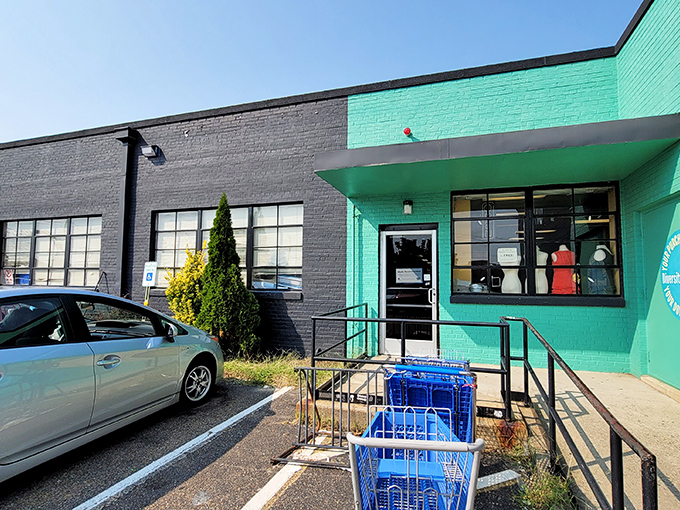 Diversity Thrift's bold teal and charcoal exterior is as unapologetically vibrant as the community it serves and the treasures within.