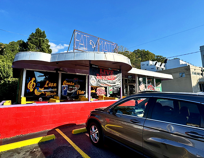 Fat Matt's retro neon sign glows like a barbecue lighthouse, guiding hungry souls toward rib salvation since before Instagram existed.