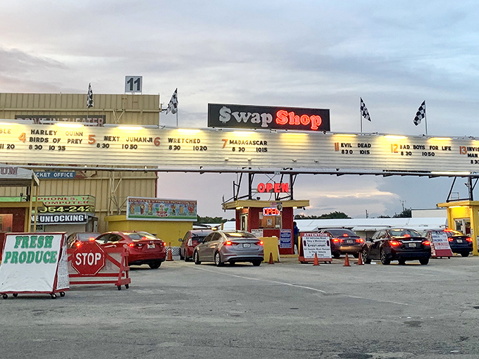Fort Lauderdale Swap Shop's interior feels like a retro mall where exotic cars and everyday treasures create a surreal shopping experience.