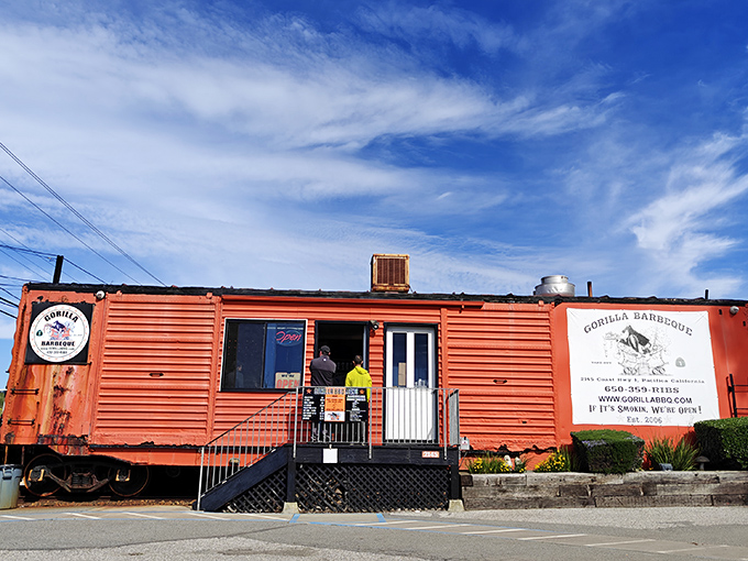 Gorilla Barbeque's bright orange railroad car stands as a beacon of hope for hungry travelers&mdash;a smoke signal of deliciousness ahead.