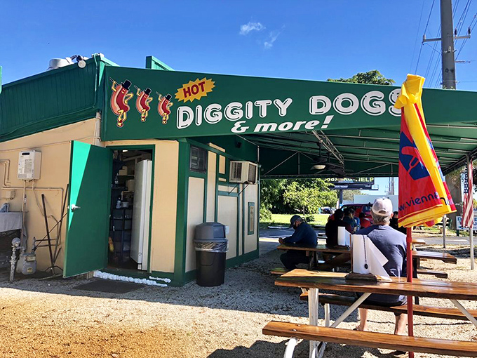 Hot Diggity Dogs' lime green building and picnic tables create the perfect casual vibe for serious hot dog contemplation and consumption.