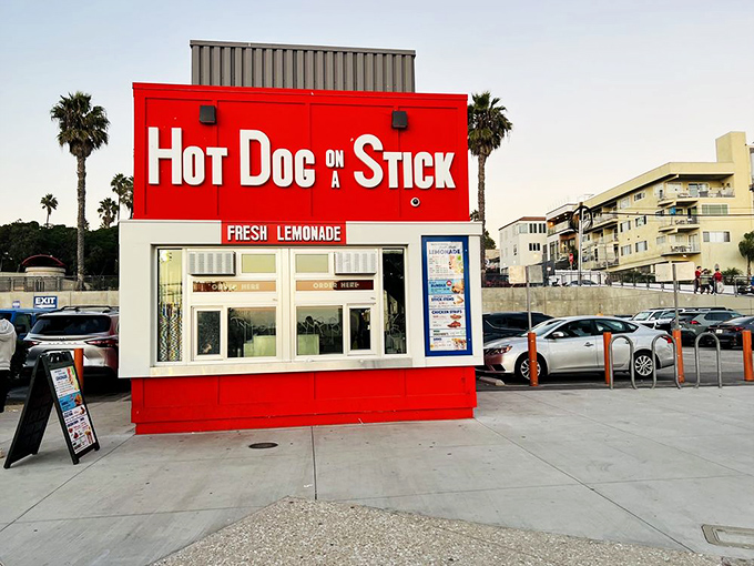Hot Dog on a Stick's bold red box of beachside delights stands ready to satisfy post-swim cravings at Santa Monica Pier.