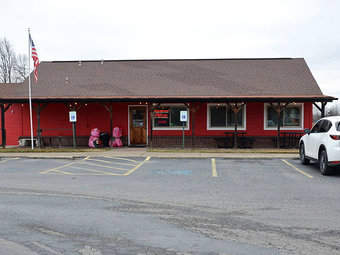 Mean Pig BBQ: "Red trim, American flag, and smoke signals. This unassuming spot serves patriotism and pork with equal enthusiasm."