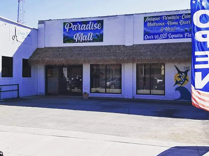 Paradise Mall's thatched entrance promises exotic treasures within. Tropical name, heartland charm!