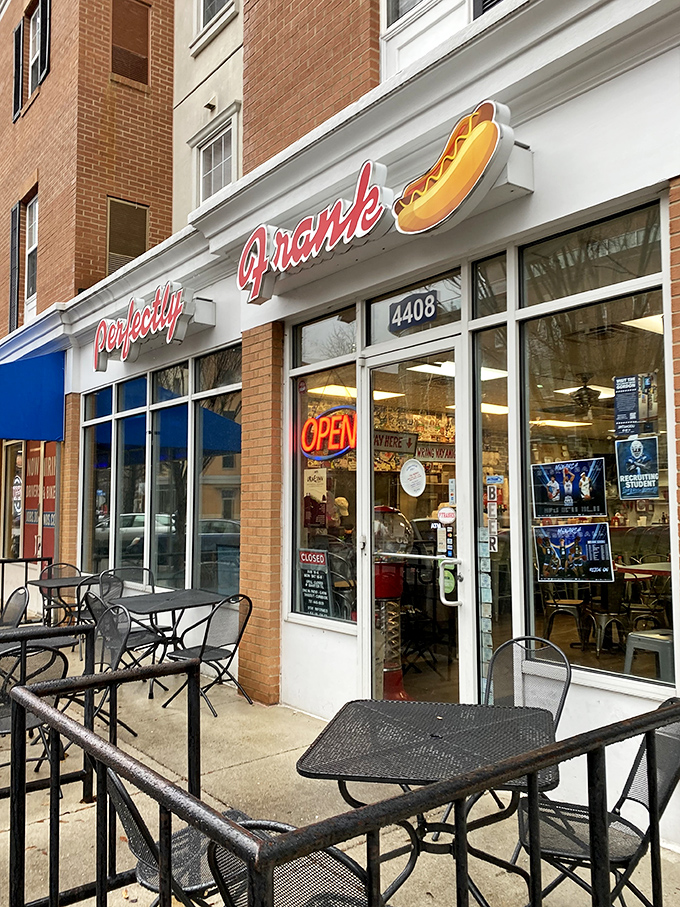 Perfectly Frank's brick facade and outdoor seating create the ideal setting for contemplating the deeper meaning of hot dog excellence.