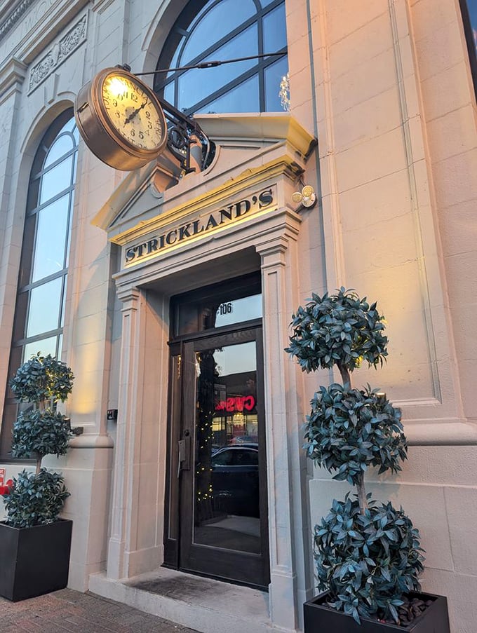 Strickland's elegant clock and entrance&mdash;because sometimes great steaks deserve the architectural equivalent of a tuxedo.