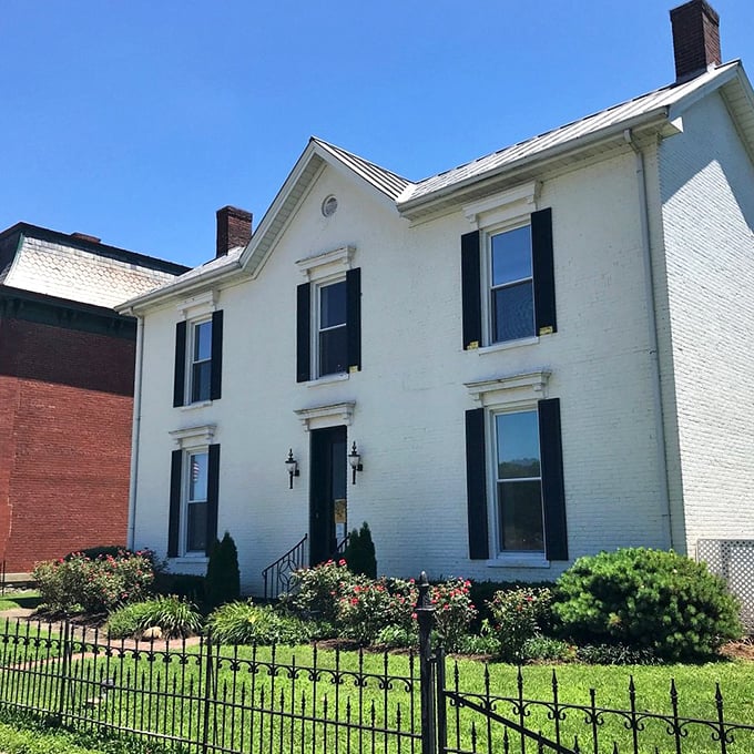 This classic white house with black shutters is the architectural equivalent of a perfectly tailored tuxedo.