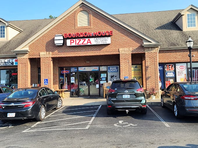 The unassuming strip mall location belies the flavor explosions happening inside this Kentucky pizza haven.