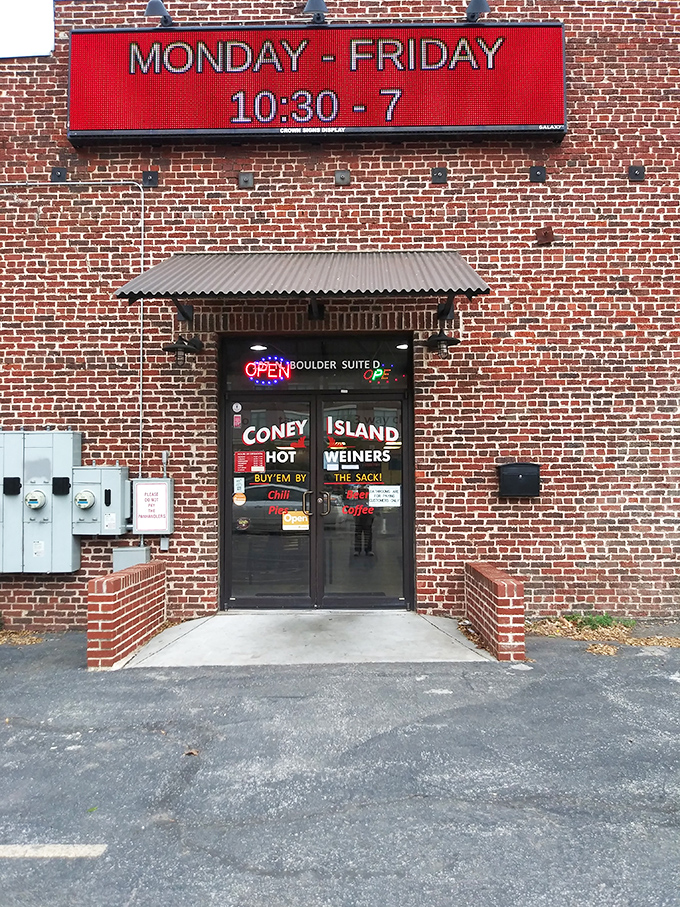 Digital sign, analog flavors. Coney Island's straightforward exterior houses generations of hot dog craftsmanship that time hasn't changed.