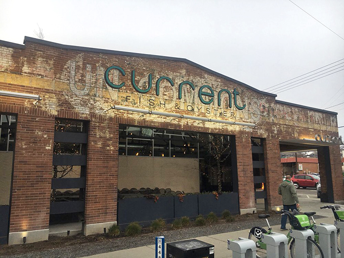 The weathered sign and industrial charm of Current make it look like it's been serving perfect oysters for a century.